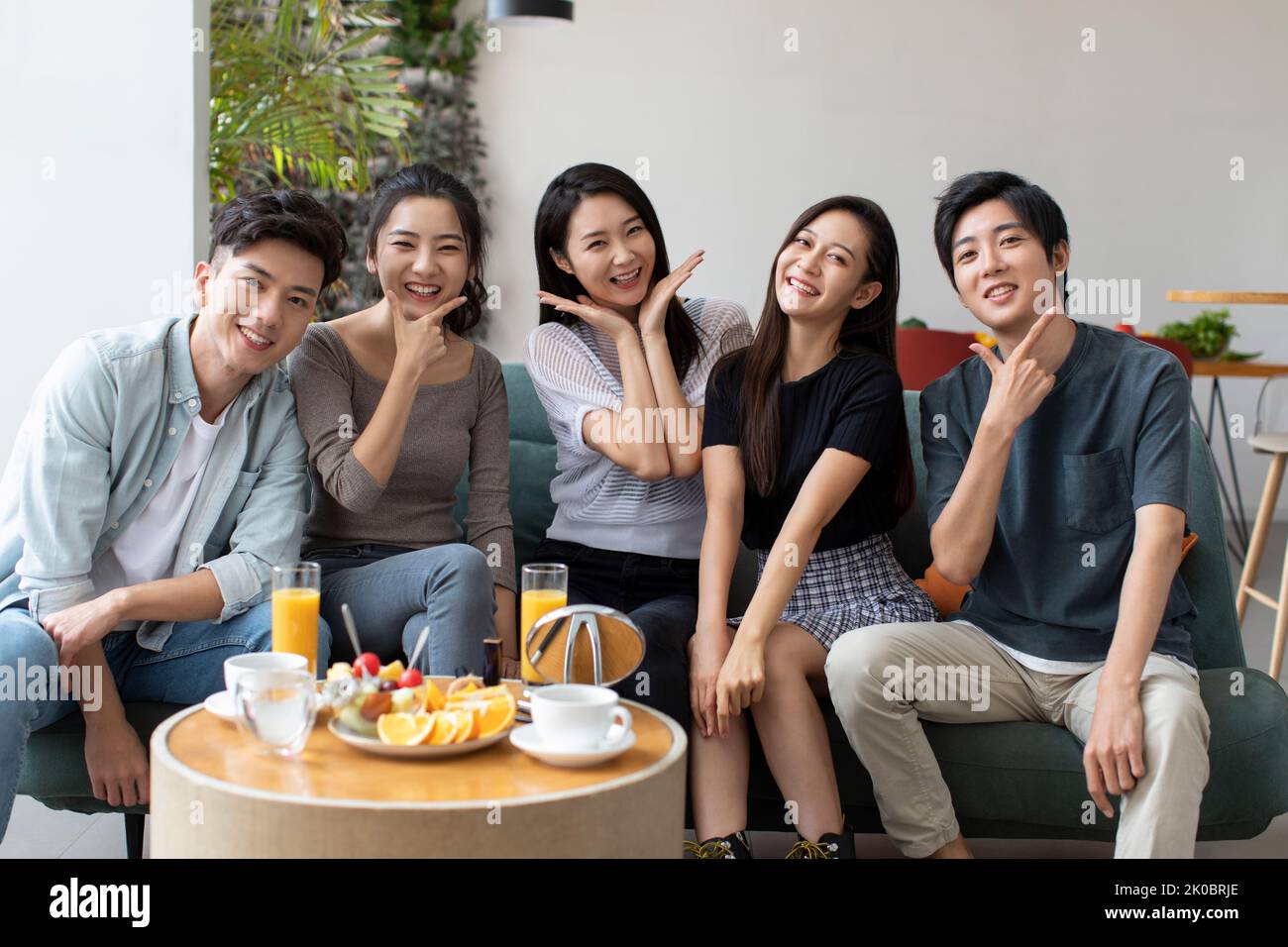 Portrait of happy young Chinese friends Stock Photo - Alamy