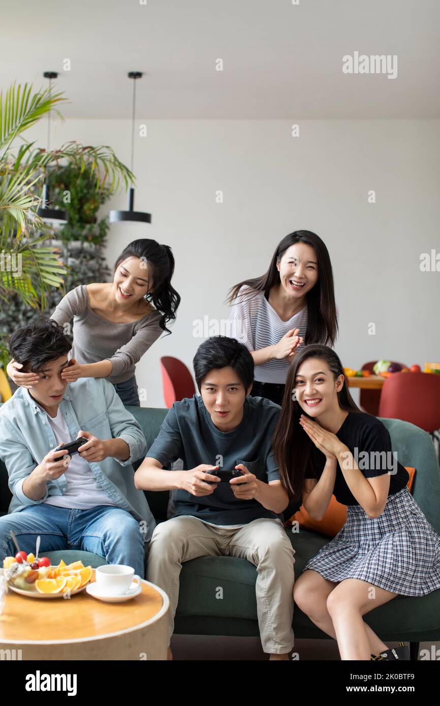 Happy Chinese friends having fun together Stock Photo - Alamy