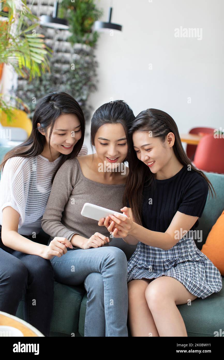 Happy Chinese friends having fun together Stock Photo - Alamy