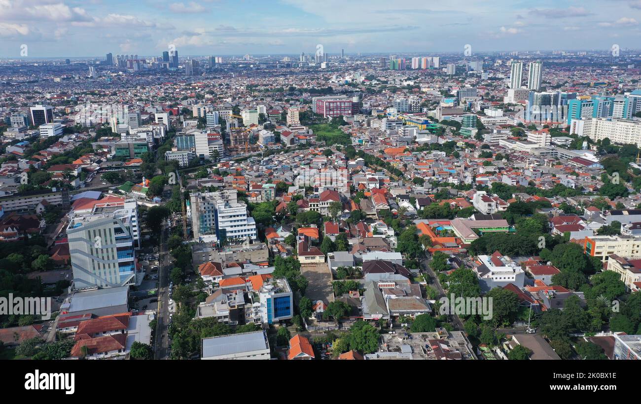 Aerial view of beautiful Jakarta downtown under blue sky at morning ...