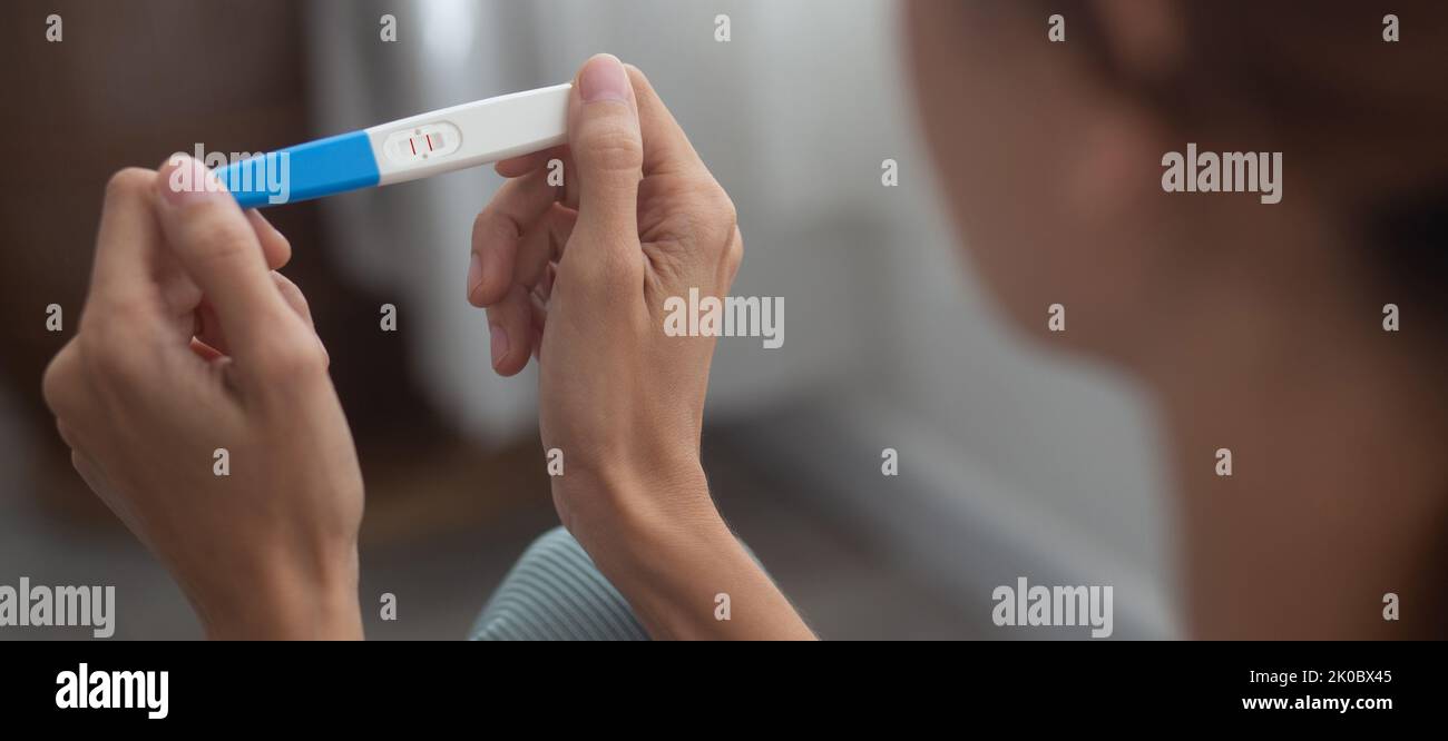 Happiness young asian woman taking pregnancy test while excited and ...