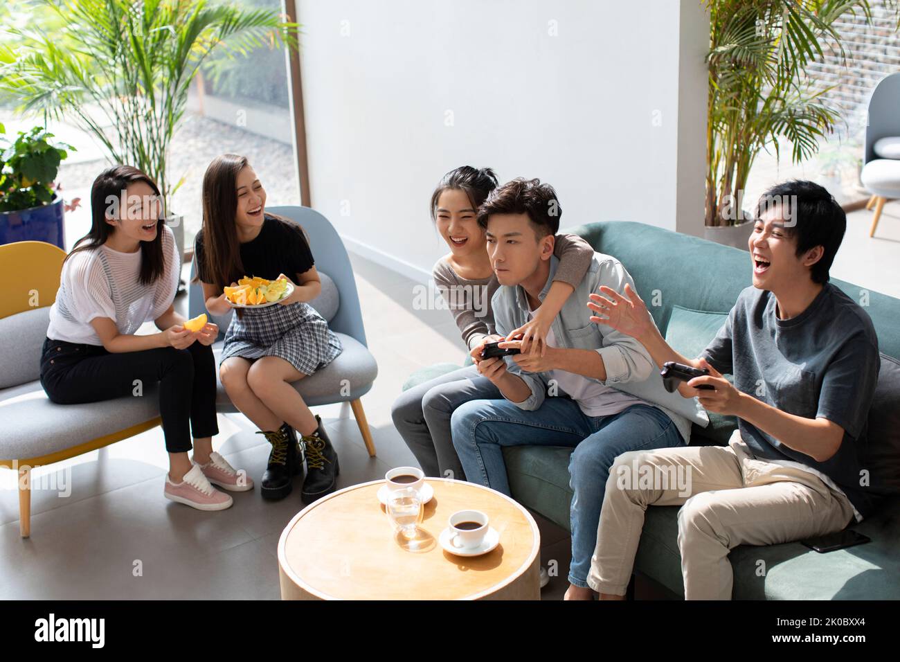 Happy Chinese friends having fun together Stock Photo - Alamy