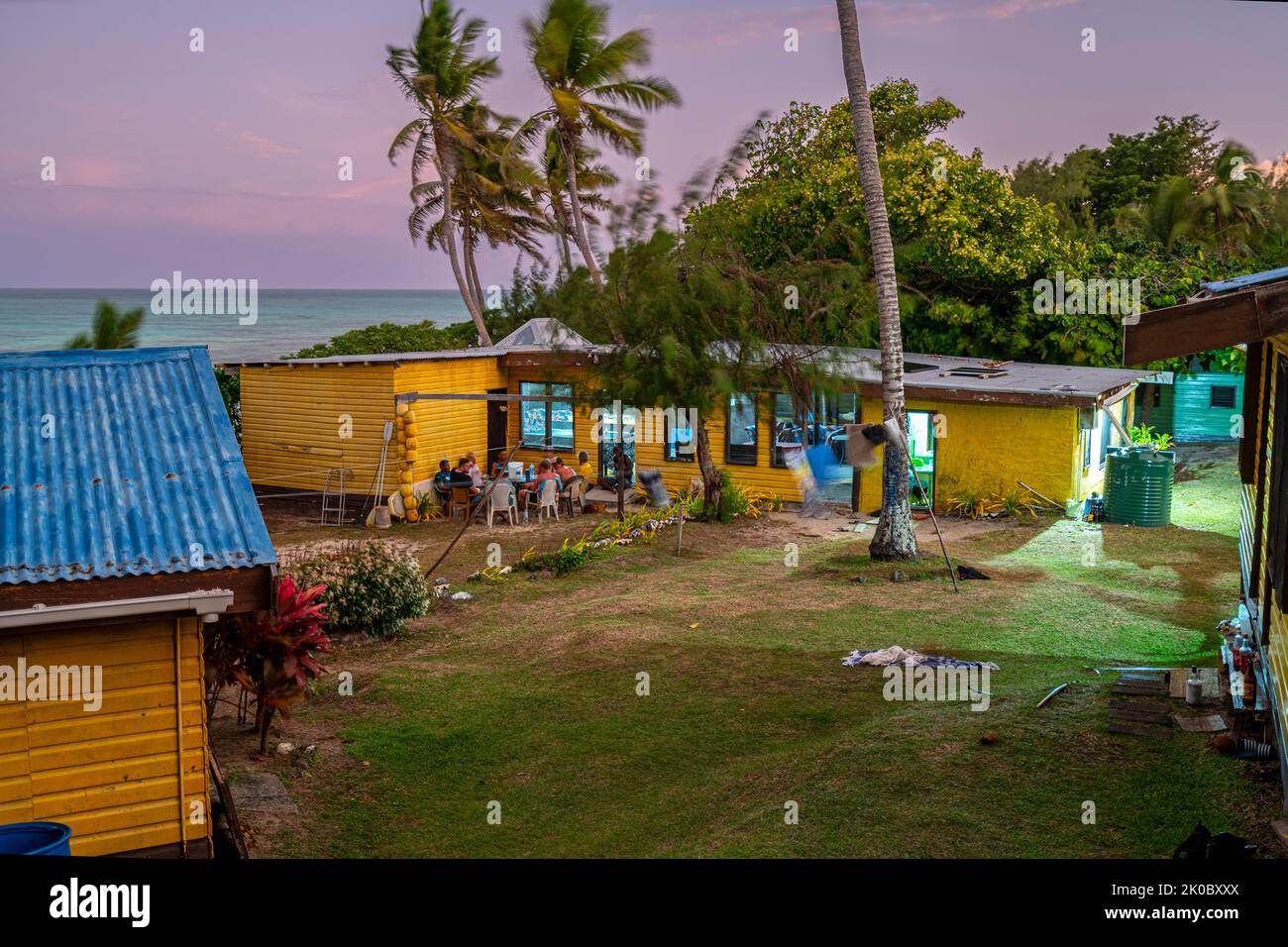 Guests socialising outside in the evening at homestay on Nanuya Lailai ...