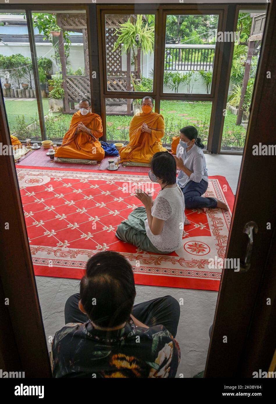 Devotees offering prayers during the blessing ceremony. Thai Buddhist ...