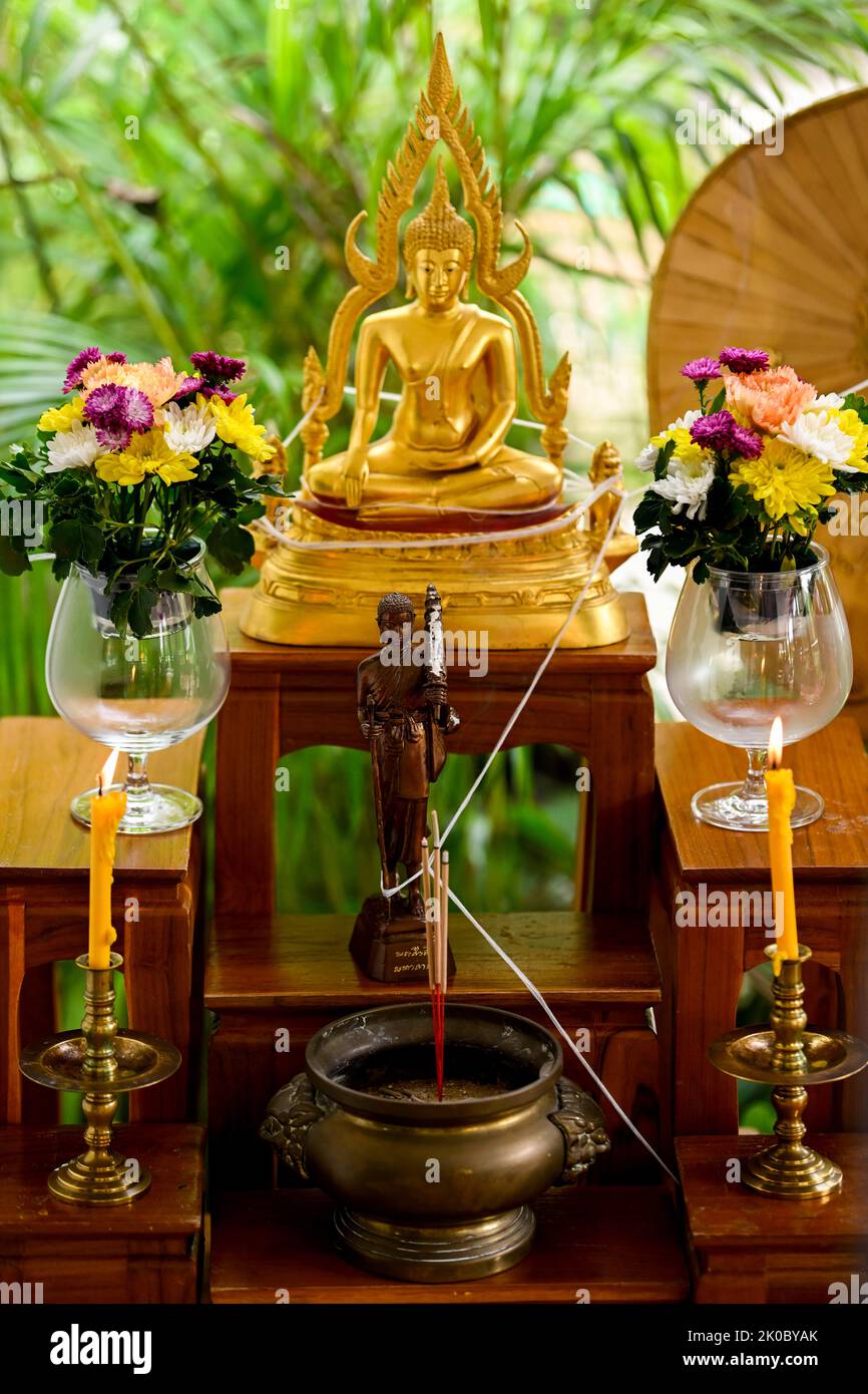 A close up of a Thai shrine during a blessing ceremony. Thai Buddhist ...