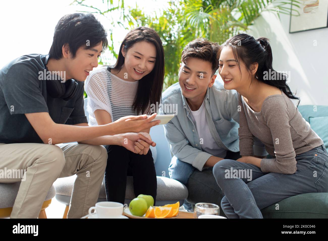 Happy Chinese friends having fun together Stock Photo - Alamy