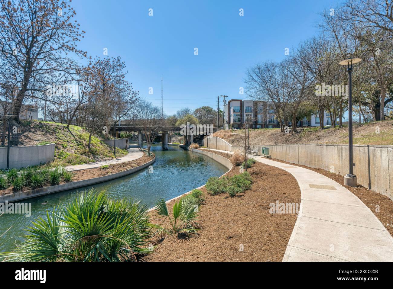 Downtown San Antonio, Texas- Two concrete walkways on both sides of the ...
