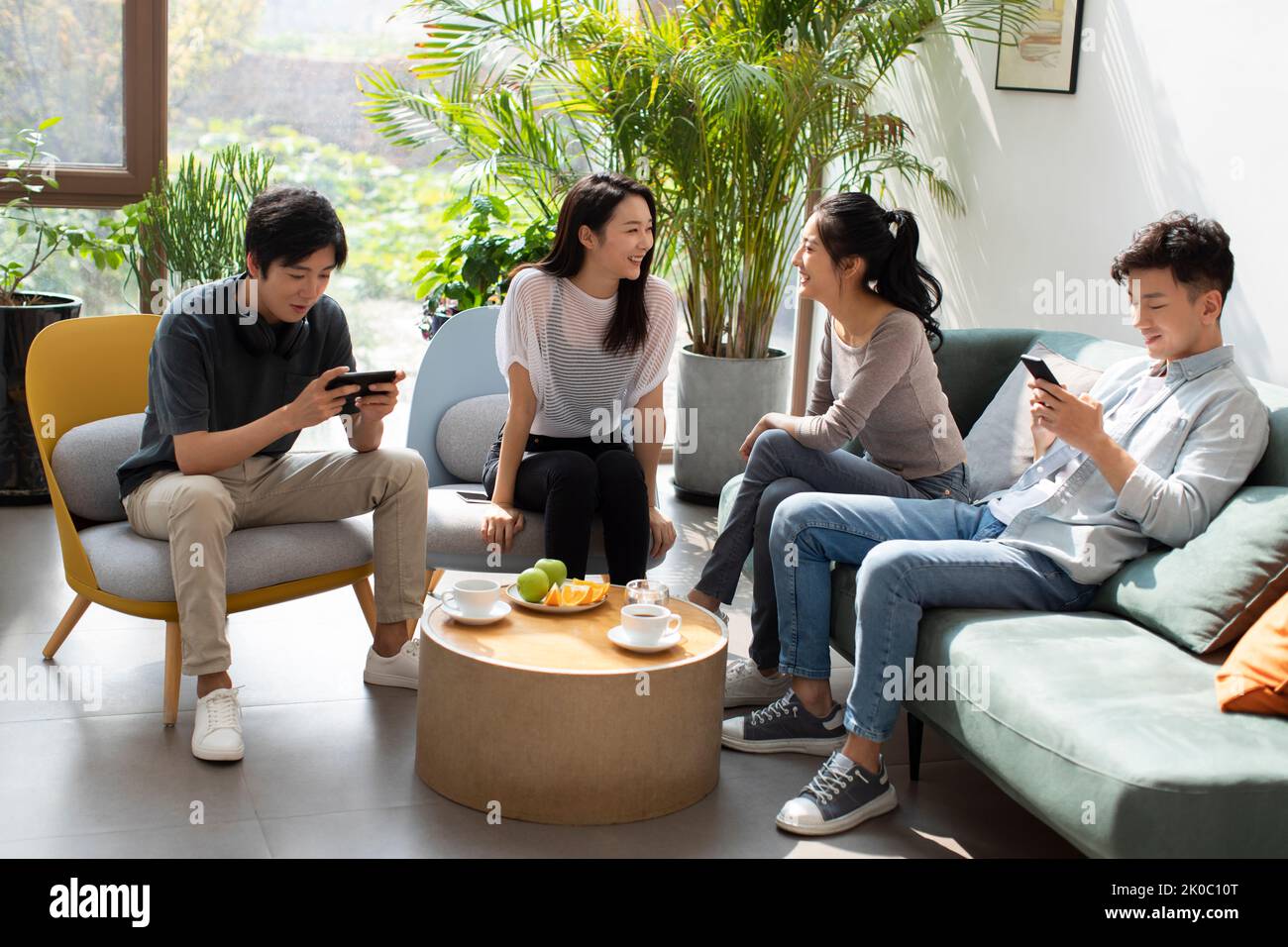 Happy Chinese friends having fun together Stock Photo - Alamy