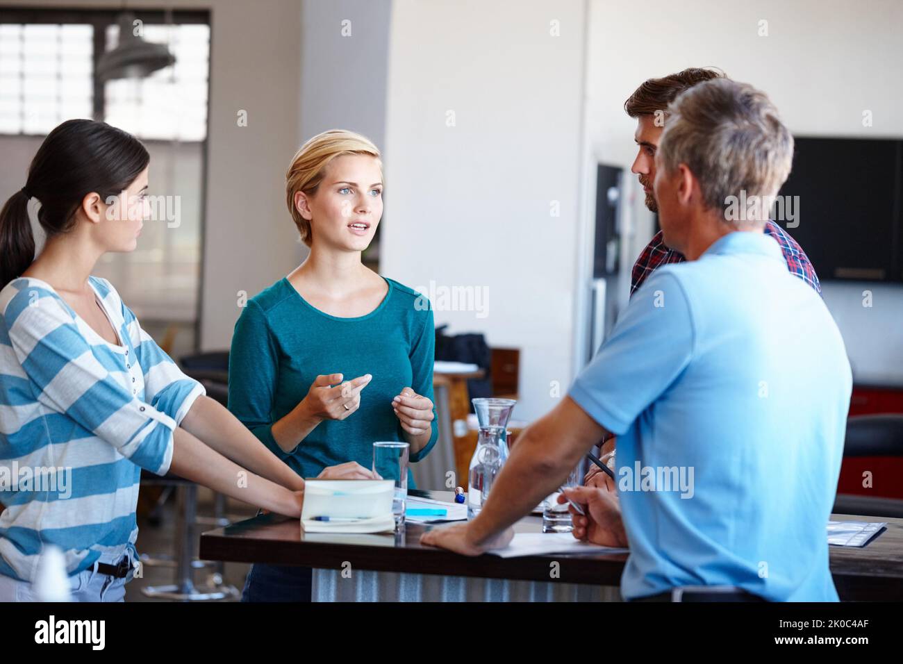 Transform your thinking. a group of colleagues having a brainstorming ...