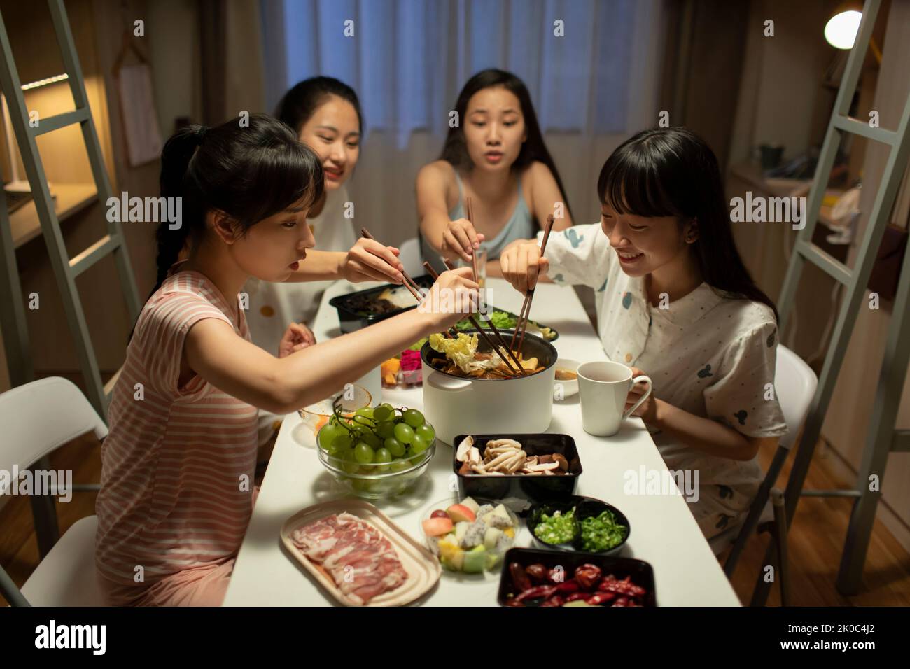 Young Chinese university students having chaffy dish in dormitory Stock ...