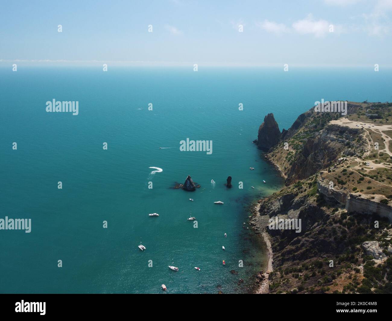 Aerial yacht on calm sea. Luxury cruise trip. View from above of white ...