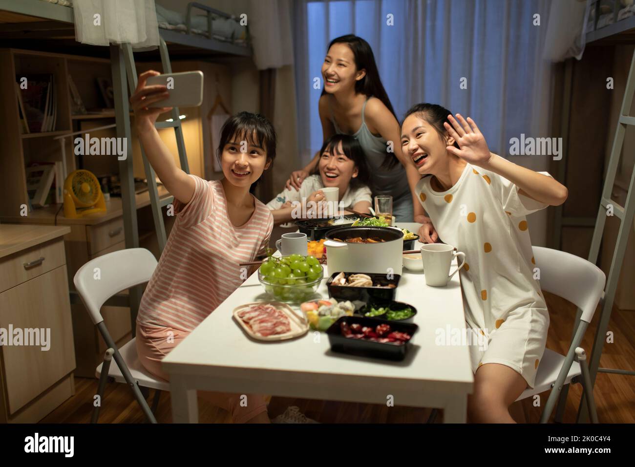 Young Chinese university students having chaffy dish in dormitory Stock ...