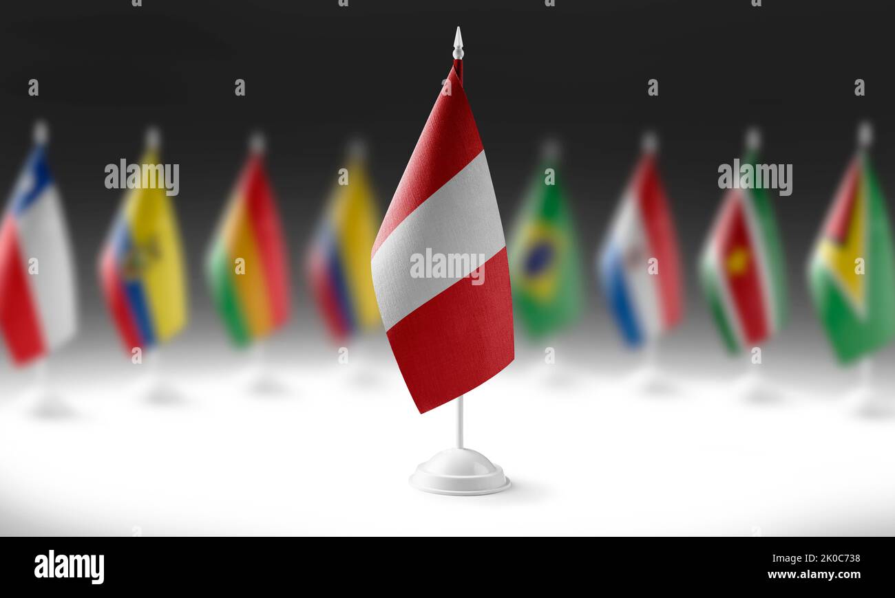 The national flag of the Peru on the background of flags of other ...