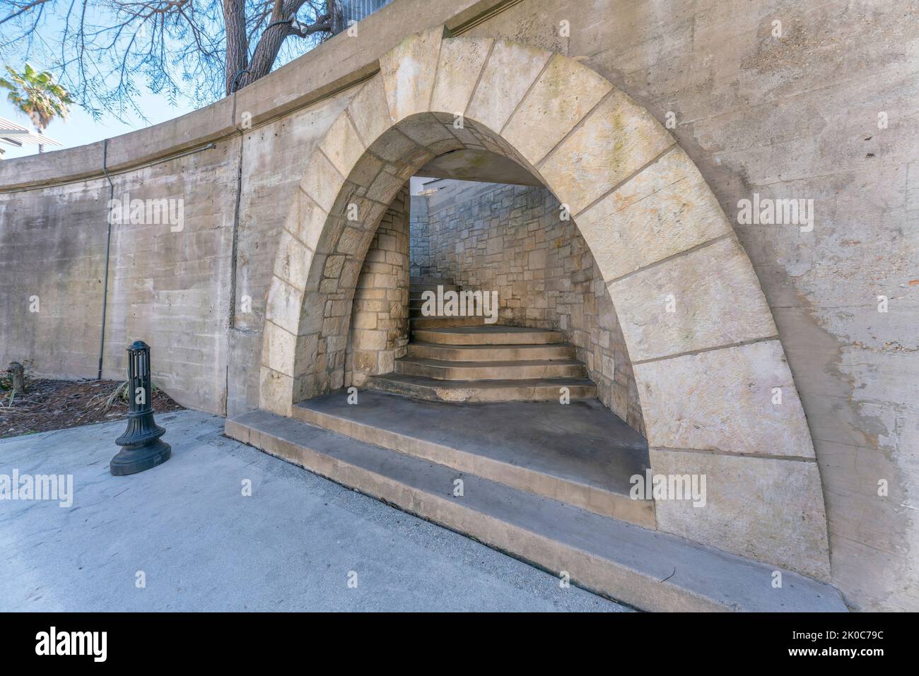 San Antonio, Texas- Archway below a bridge with pathway lights at the ...