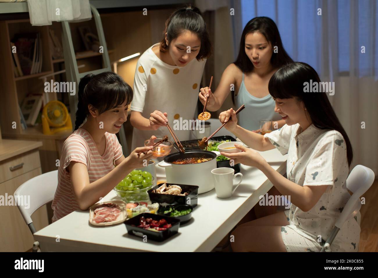 Young Chinese university students having chaffy dish in dormitory Stock ...
