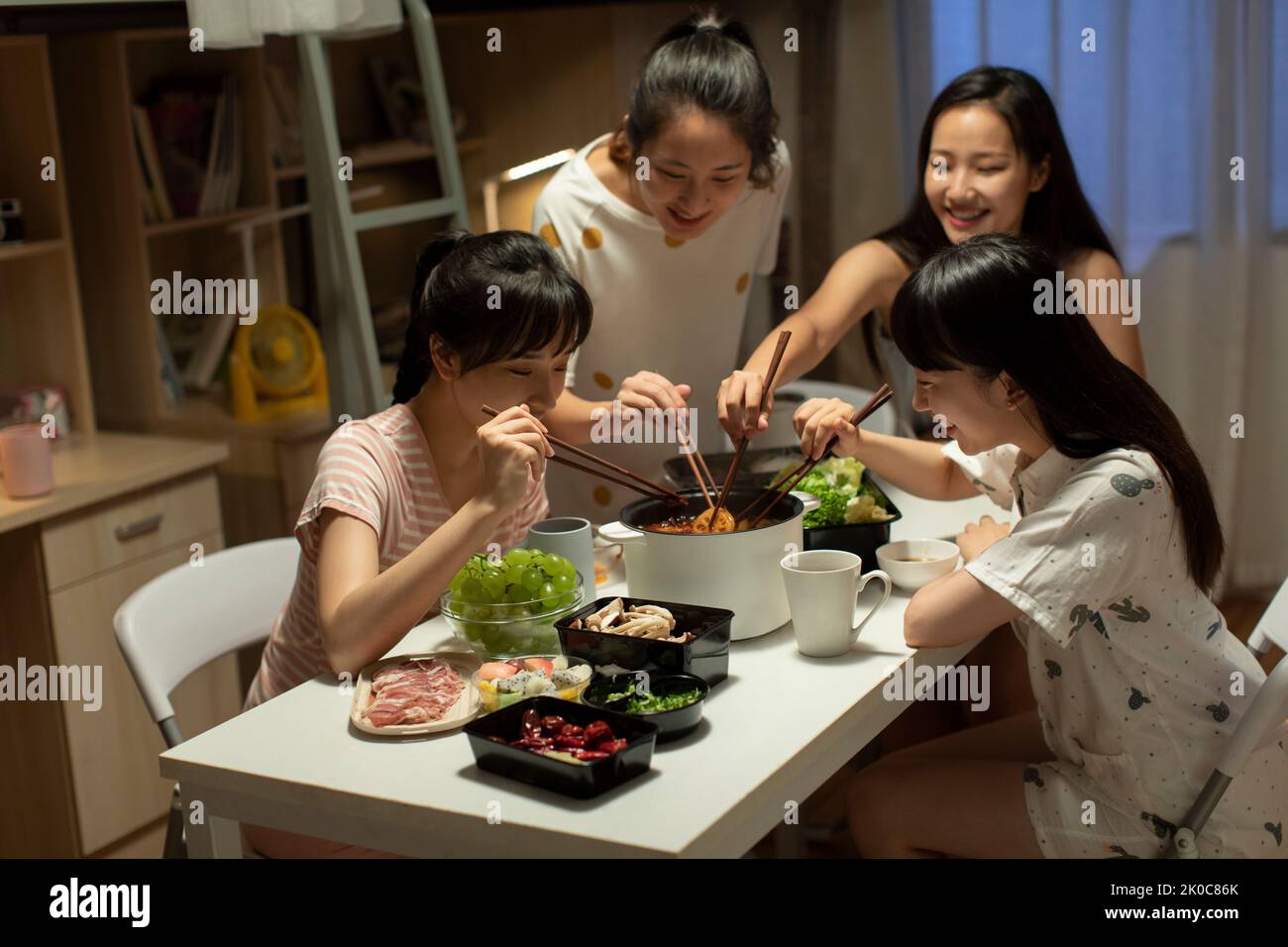 Young Chinese university students having chaffy dish in dormitory Stock ...
