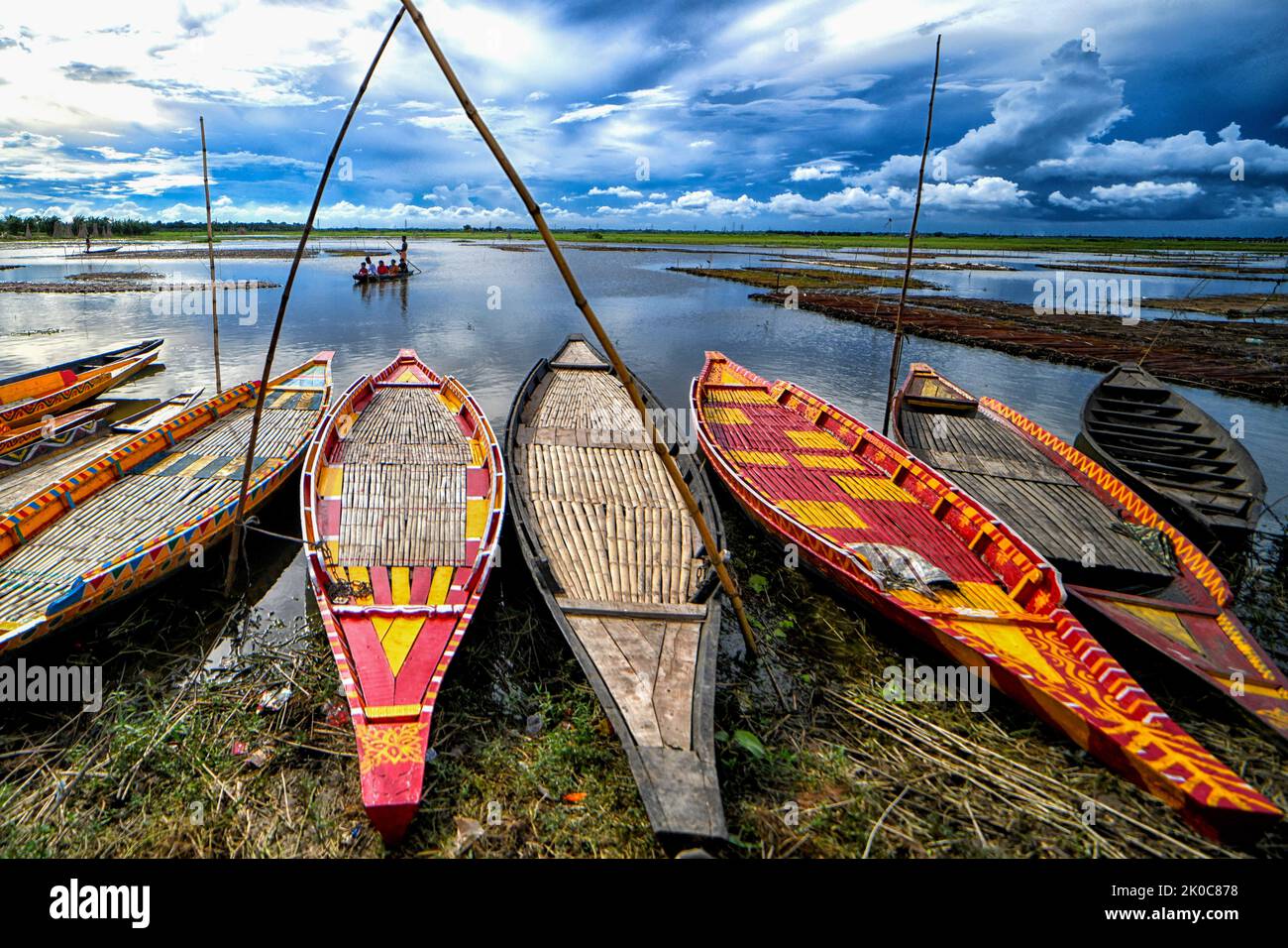 Colourful boats seen at Bortir Bill, a vast wetland surrounded by ...