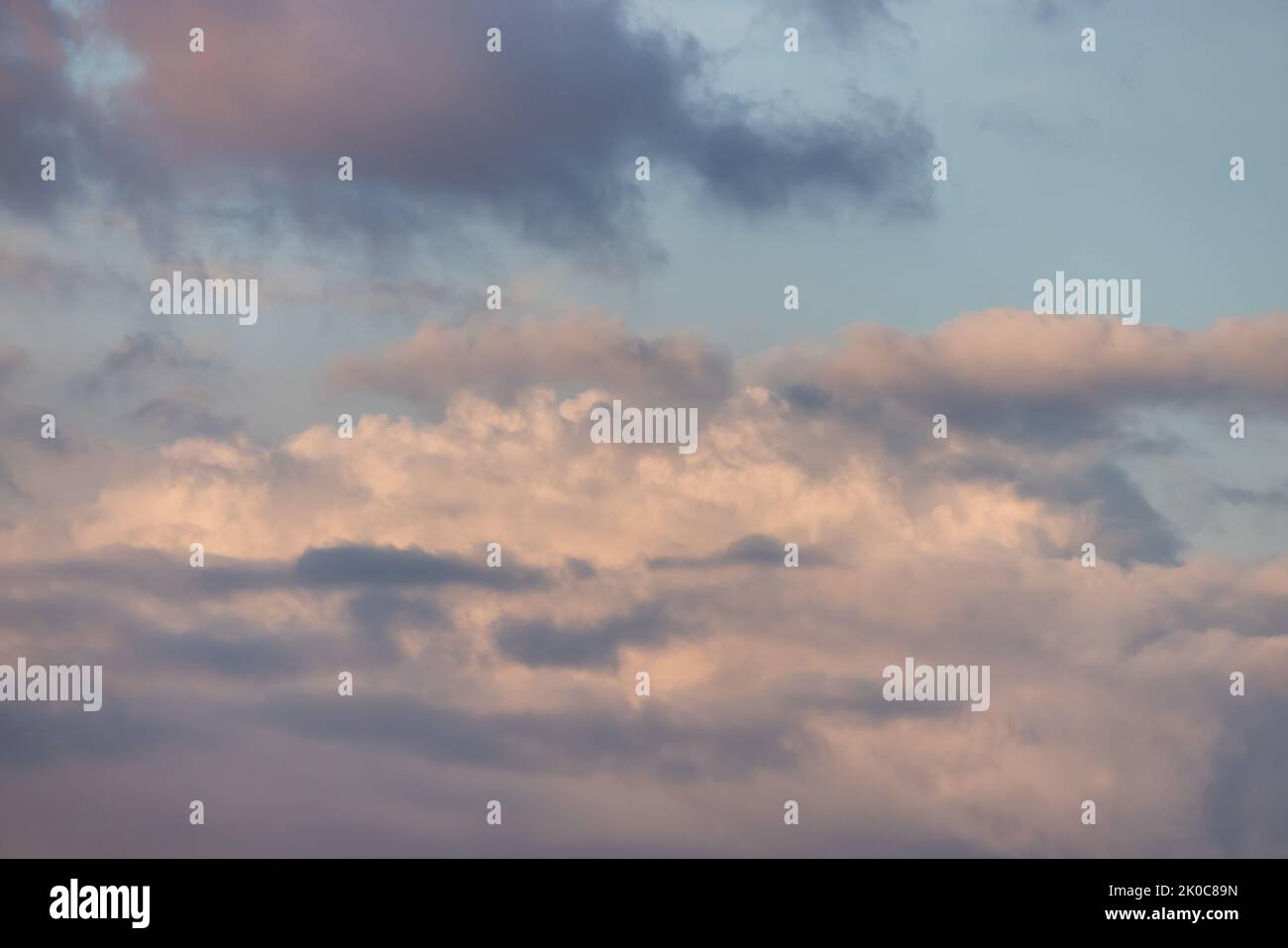 Puff Clouds in the Sky during sunset. Zoom in Stock Photo - Alamy