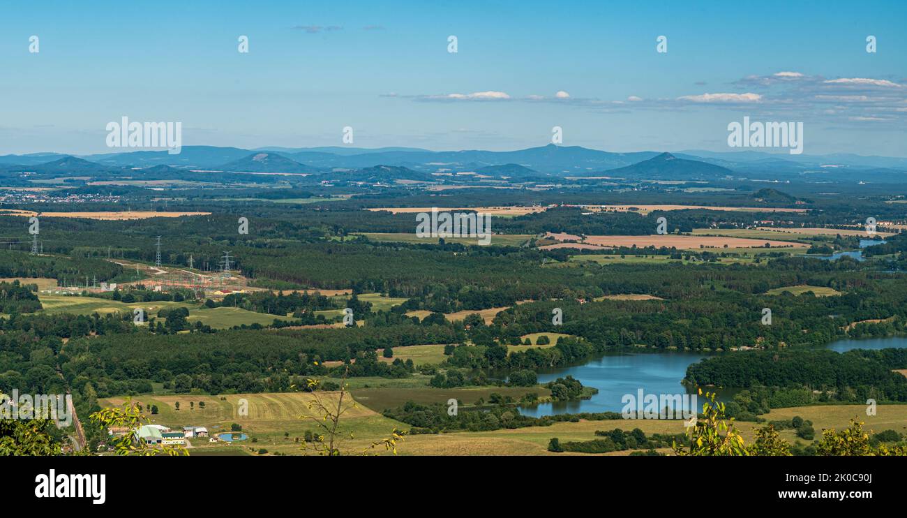Rolling rural landscape with Jested, Bezdez and Jizerske hory mountains on the background from ...