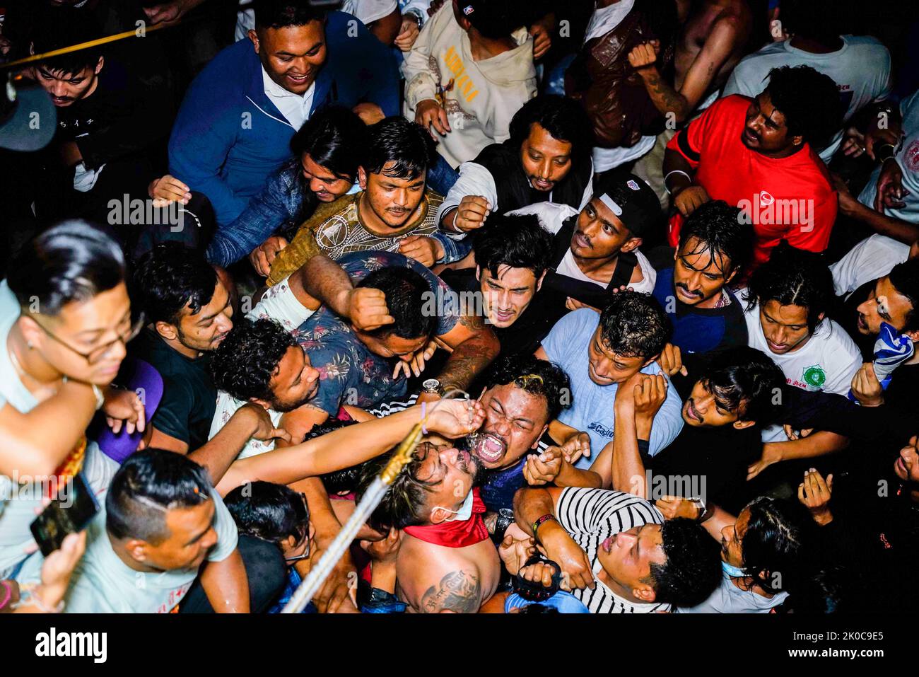Kathmandu, Nepal. 10th Sep, 2022. Youths drink homemade alcohol pouring ...