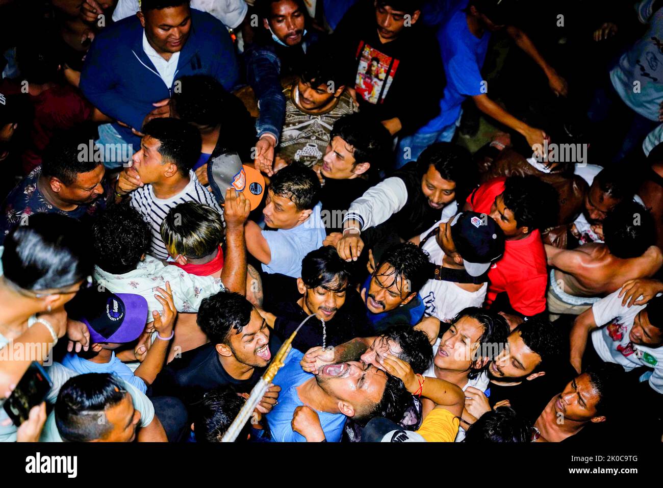 Kathmandu, Nepal. 10th Sep, 2022. Youths drink homemade alcohol pouring ...