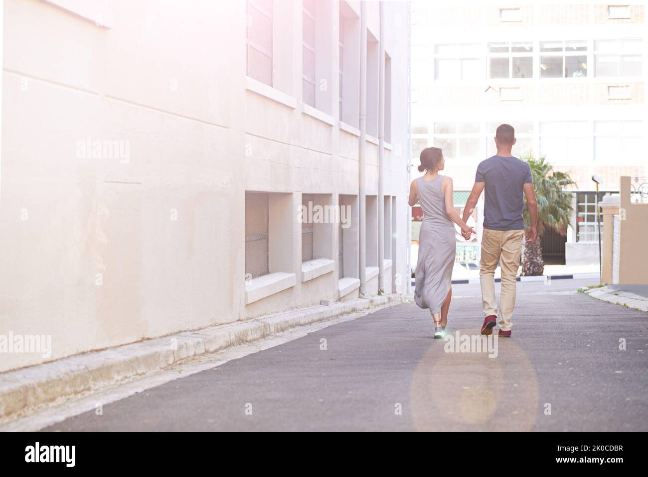 Theyre inseparable...a young couple taking a walk outdoors Stock Photo ...