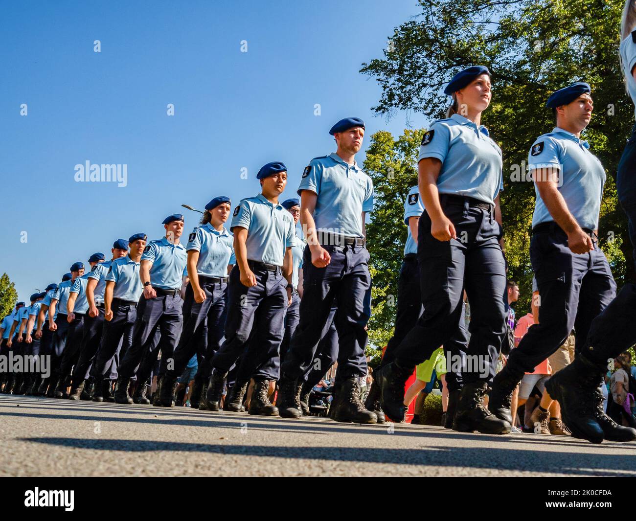 The Dutch military police are seen parading with the participants ...