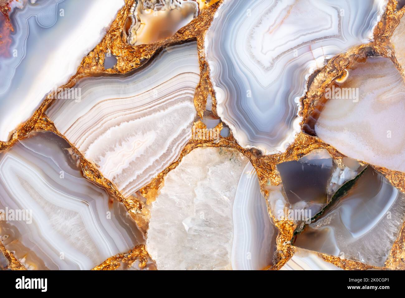 Agate Grey unique semi precious stone with a gold leaf, texture for ...