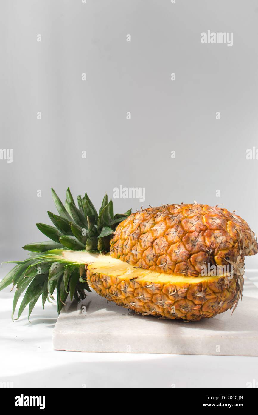 Ripe pineapple sliced in half, Cross section of pineapple fruit, Ananas ...
