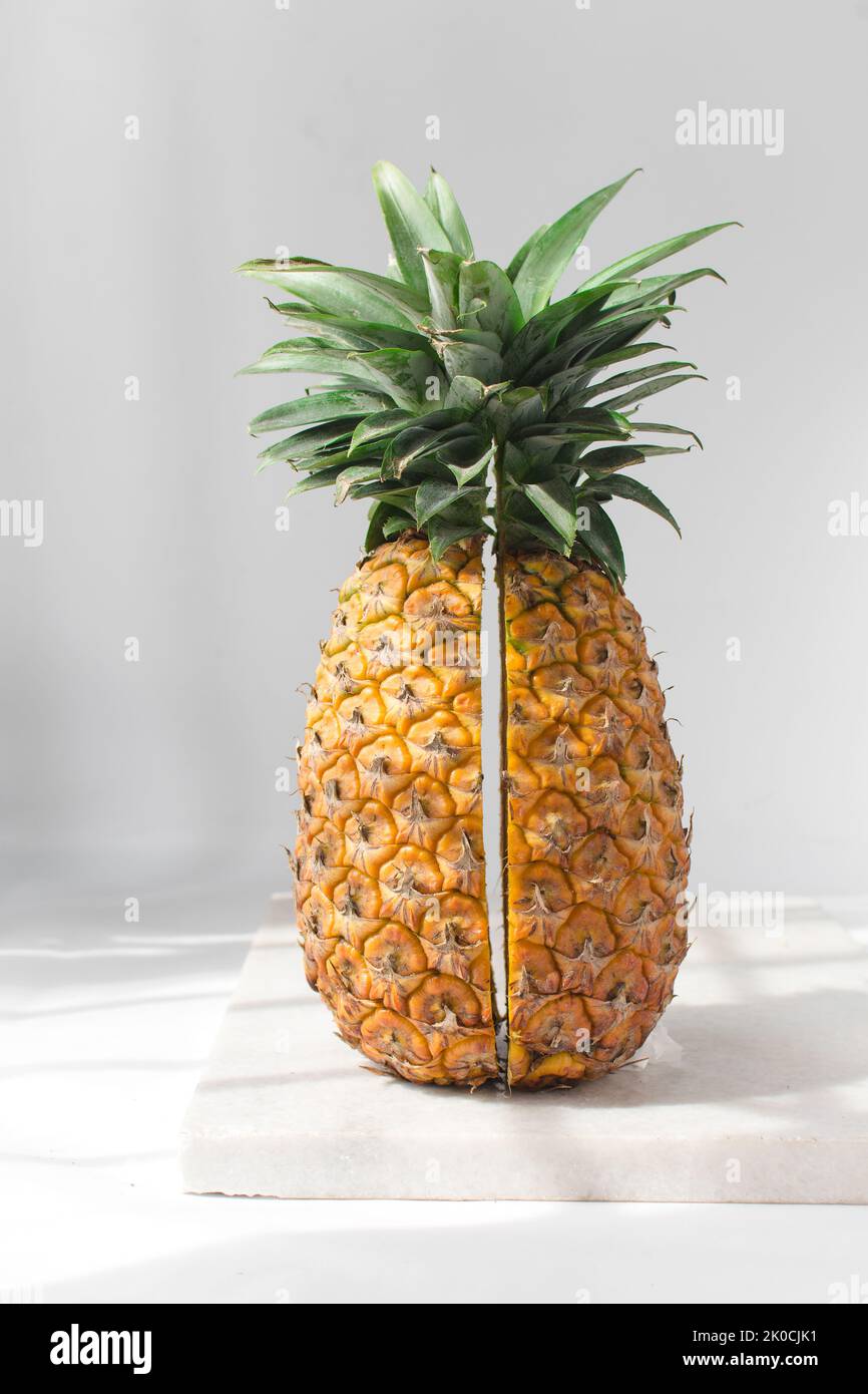 Ripe pineapple sliced in half, Cross section of pineapple fruit, Ananas ...