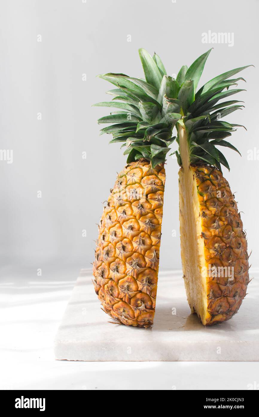 Ripe pineapple sliced in half, Cross section of pineapple fruit, Ananas ...
