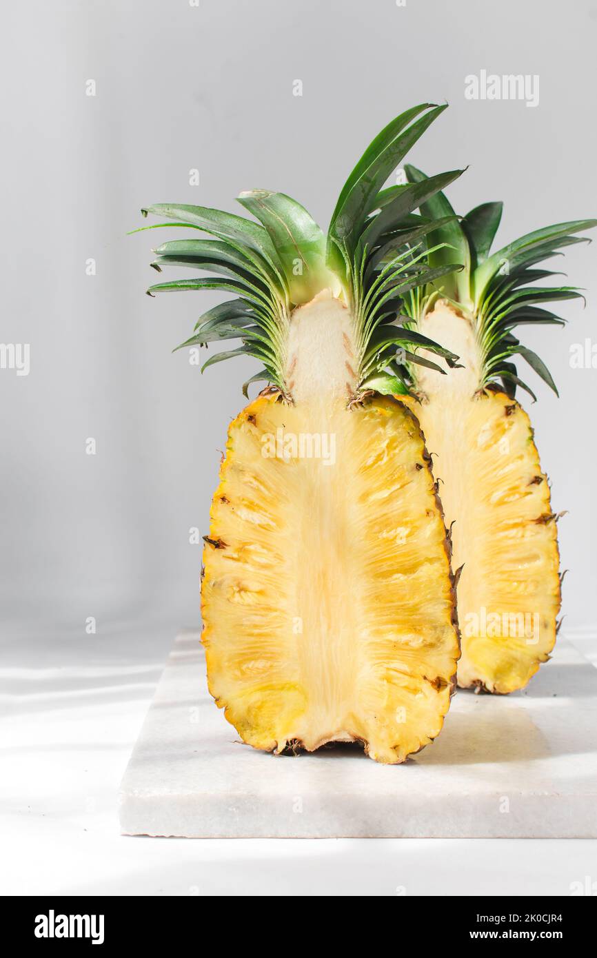 Ripe pineapple sliced in half, Cross section of pineapple fruit, Ananas ...