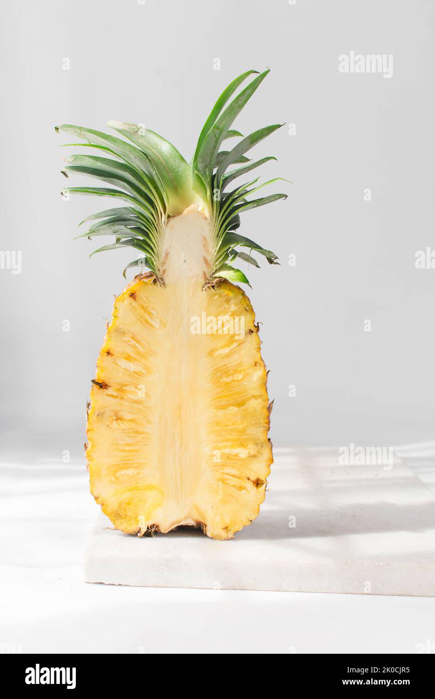 Ripe pineapple sliced in half, Cross section of pineapple fruit, Ananas ...