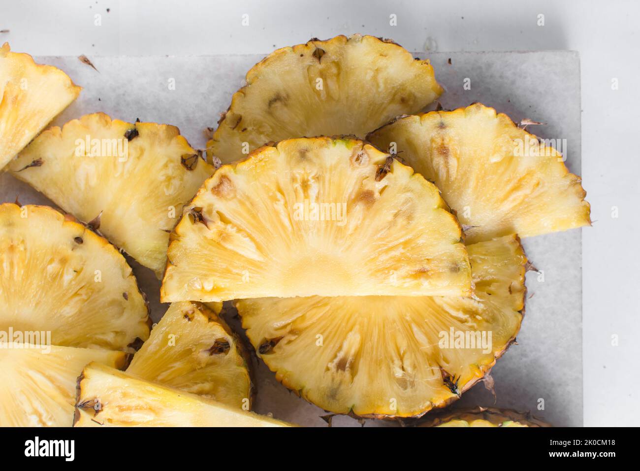 Sliced ripe pineapple, flatlay view of cut pineapple, top view of ripe ...