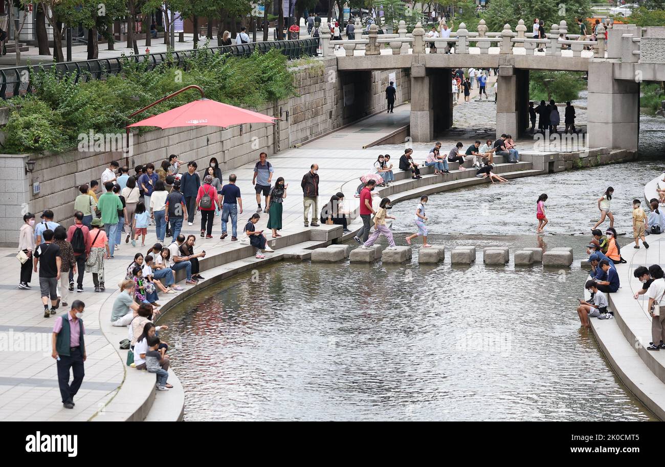 11th Sep, 2022. Holiday in downtown Seoul People sit and walk along the ...