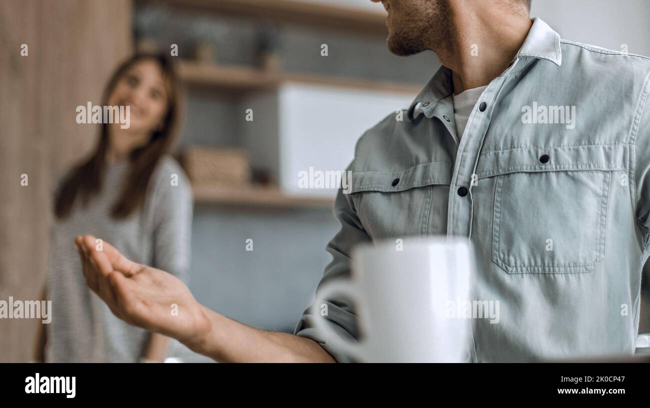 young man discussing online news in the kitchen Stock Photo - Alamy