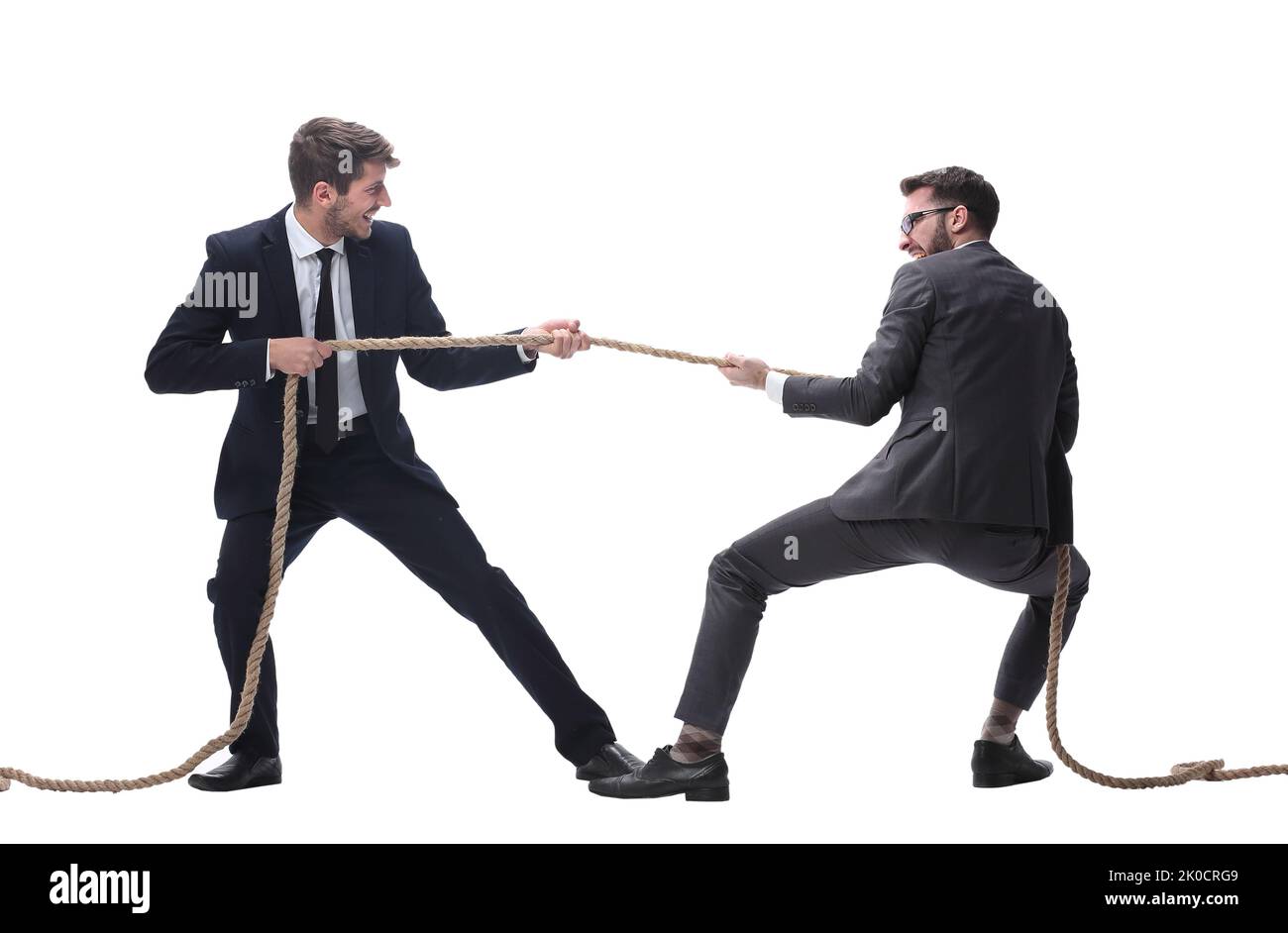 full length . two smiling businessmen pulling the rope Stock Photo - Alamy