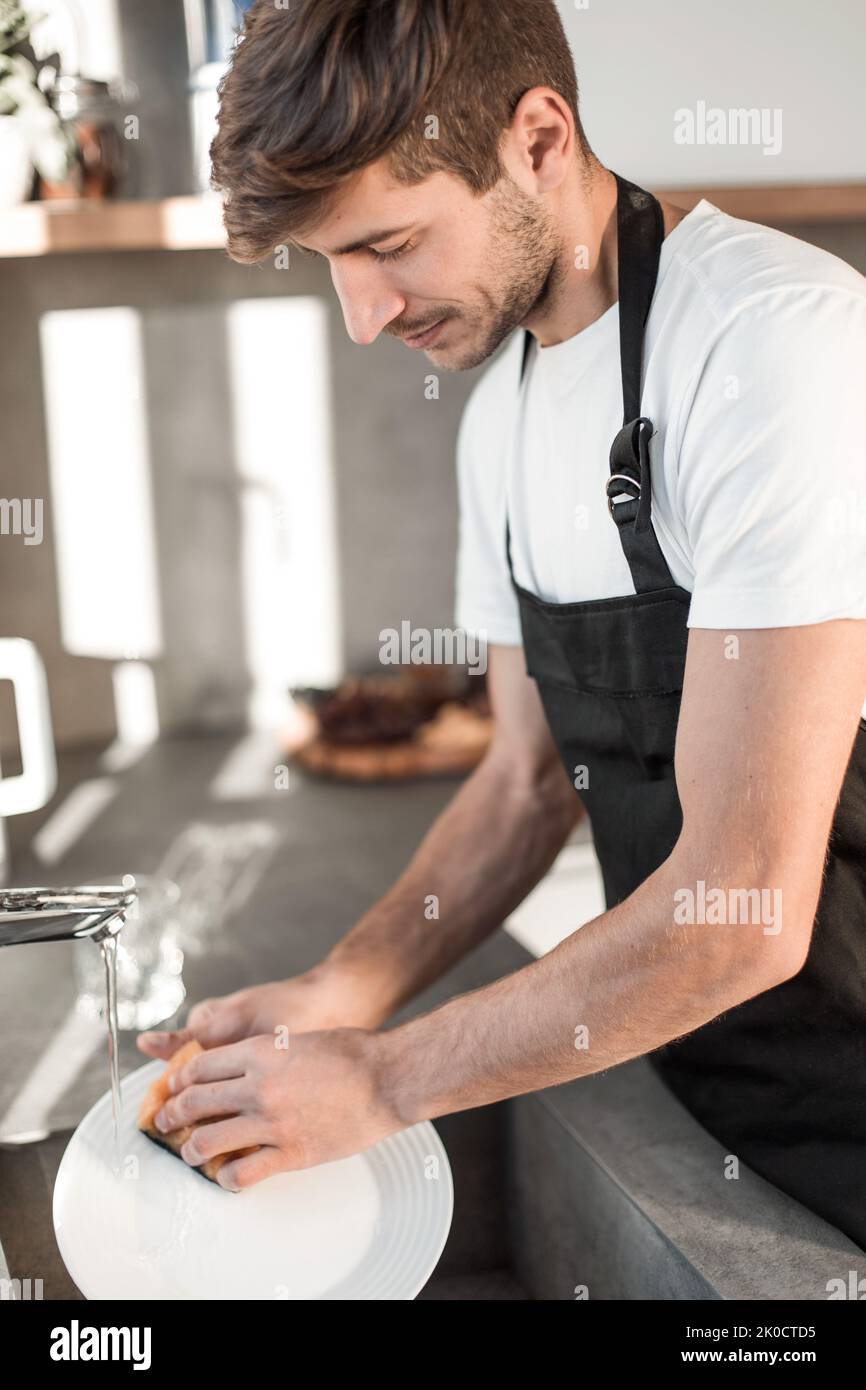 Person washes dishes hand hi-res stock photography and images - Alamy