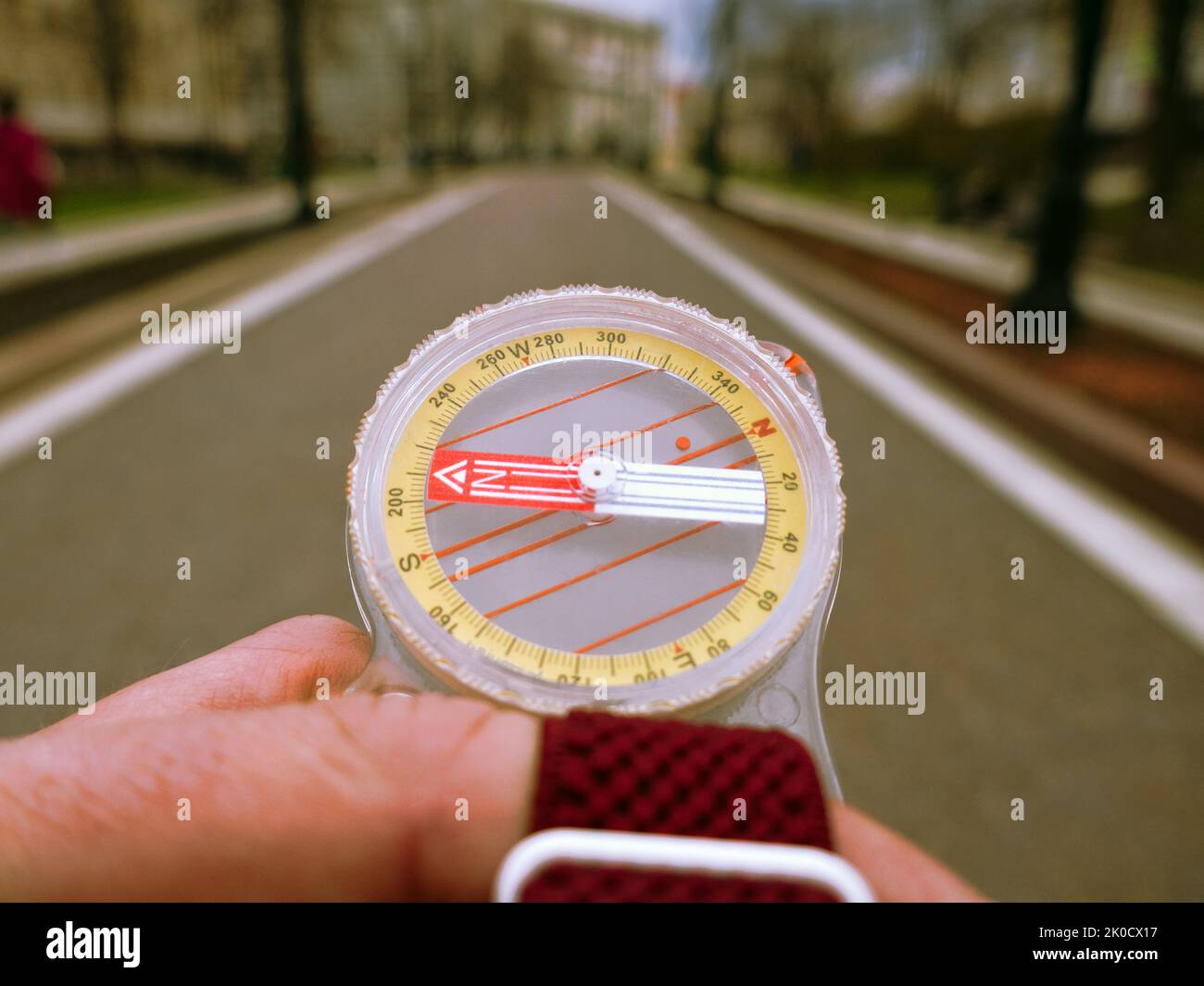 A compass in a person's hand. Orient yourself in the current situation ...