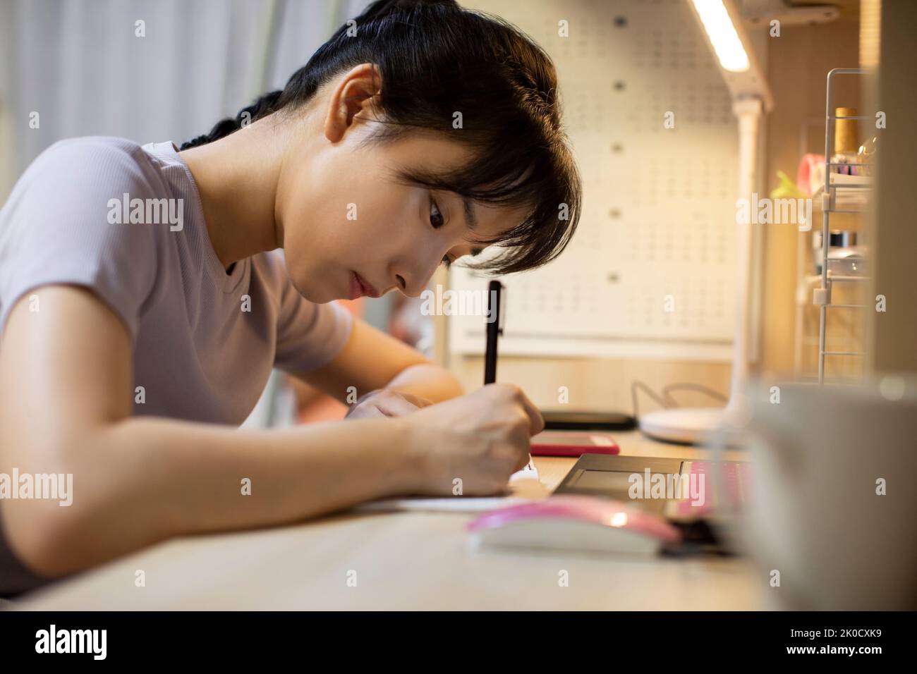 Young Chinese university student learning in dormitory Stock Photo - Alamy