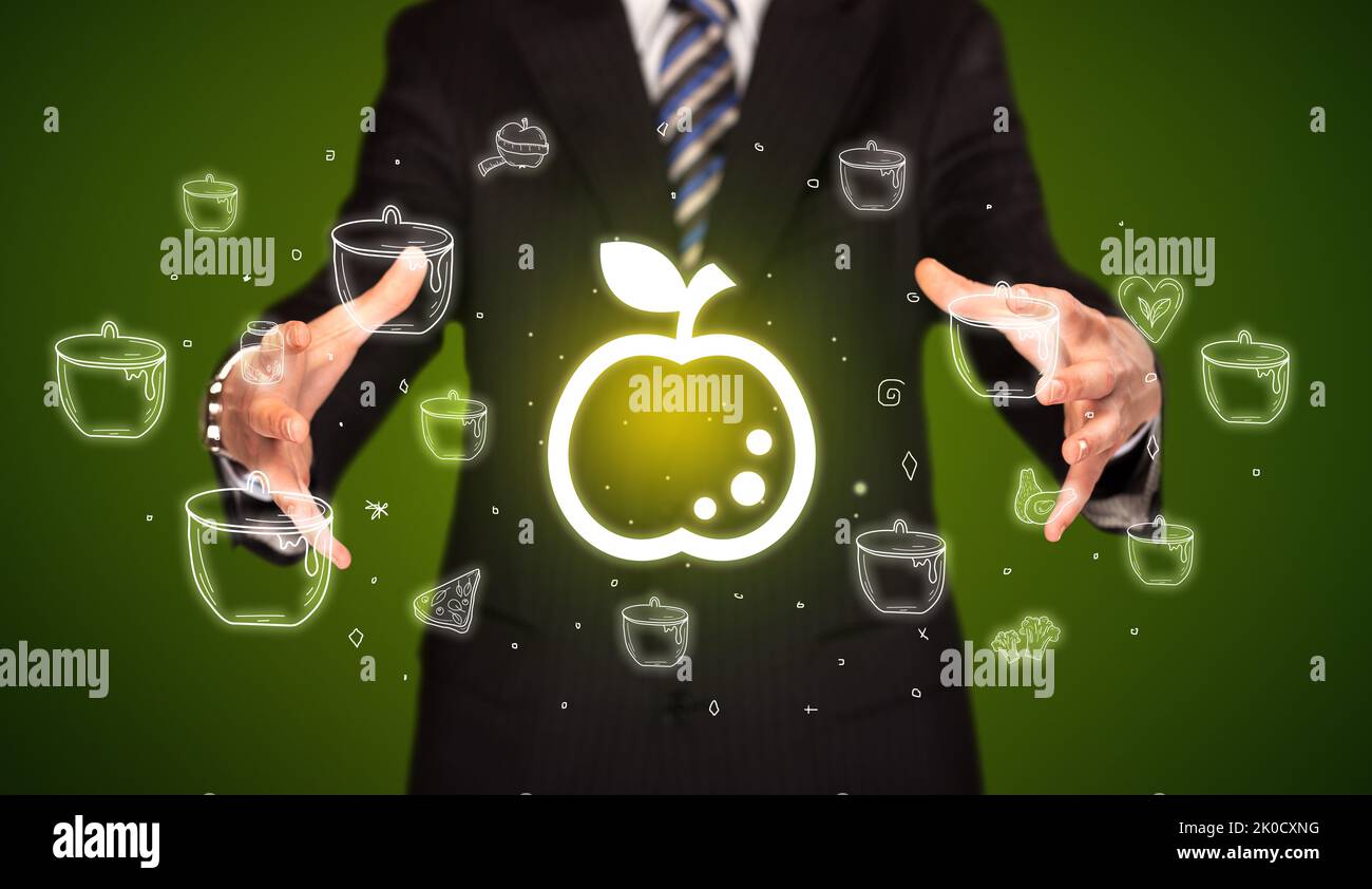 Hand holding food related icons Stock Photo - Alamy