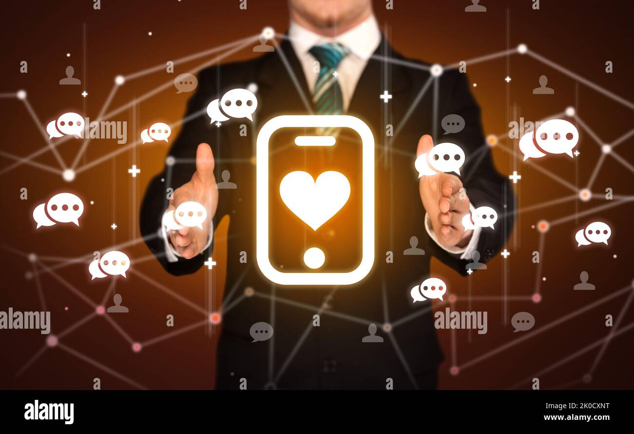 Hand holding social media icons Stock Photo - Alamy
