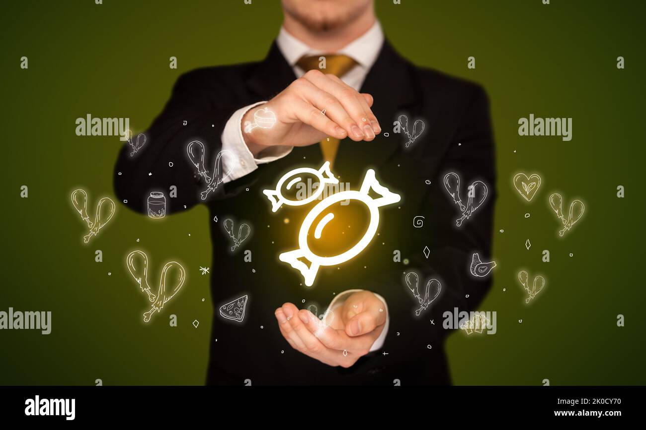 Hand holding food related icons Stock Photo - Alamy