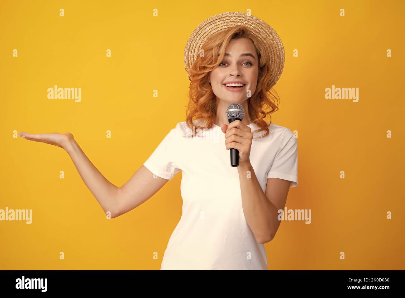 Stylish girl singing songs with microphone, holding mic at karaoke ...