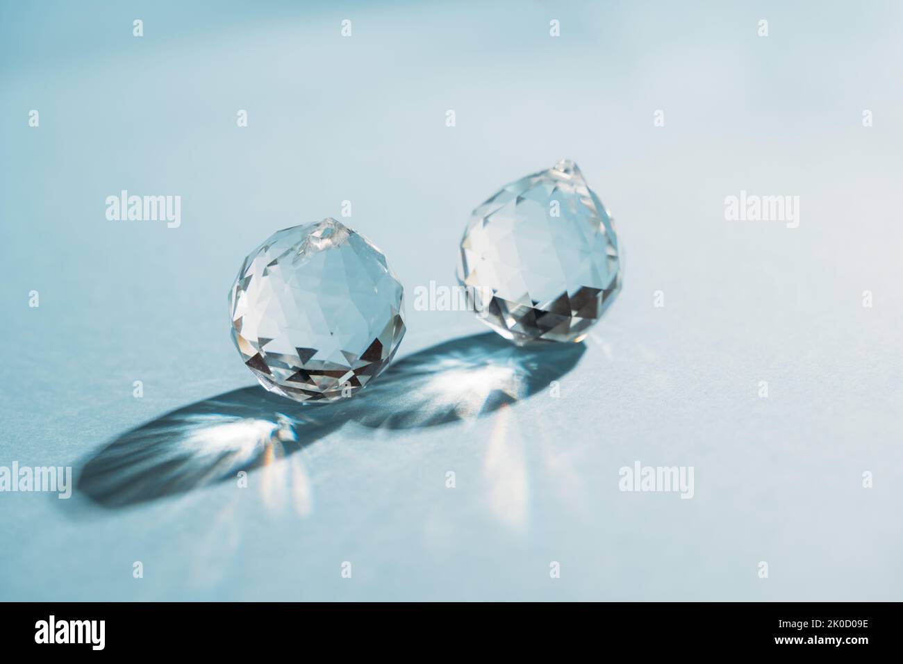 two crystals with light refraction on blue minimal background Stock ...