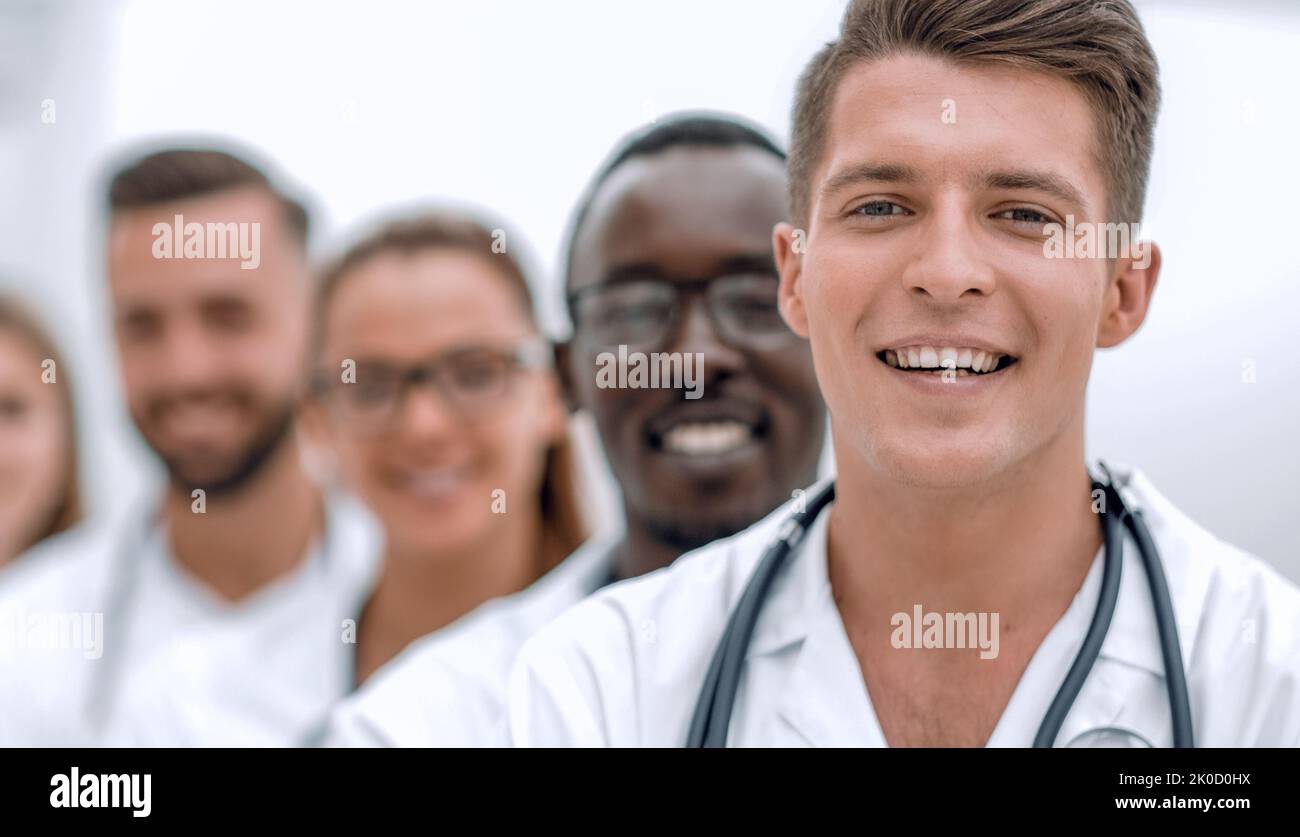Team of smiling professional doctors standing together Stock Photo - Alamy