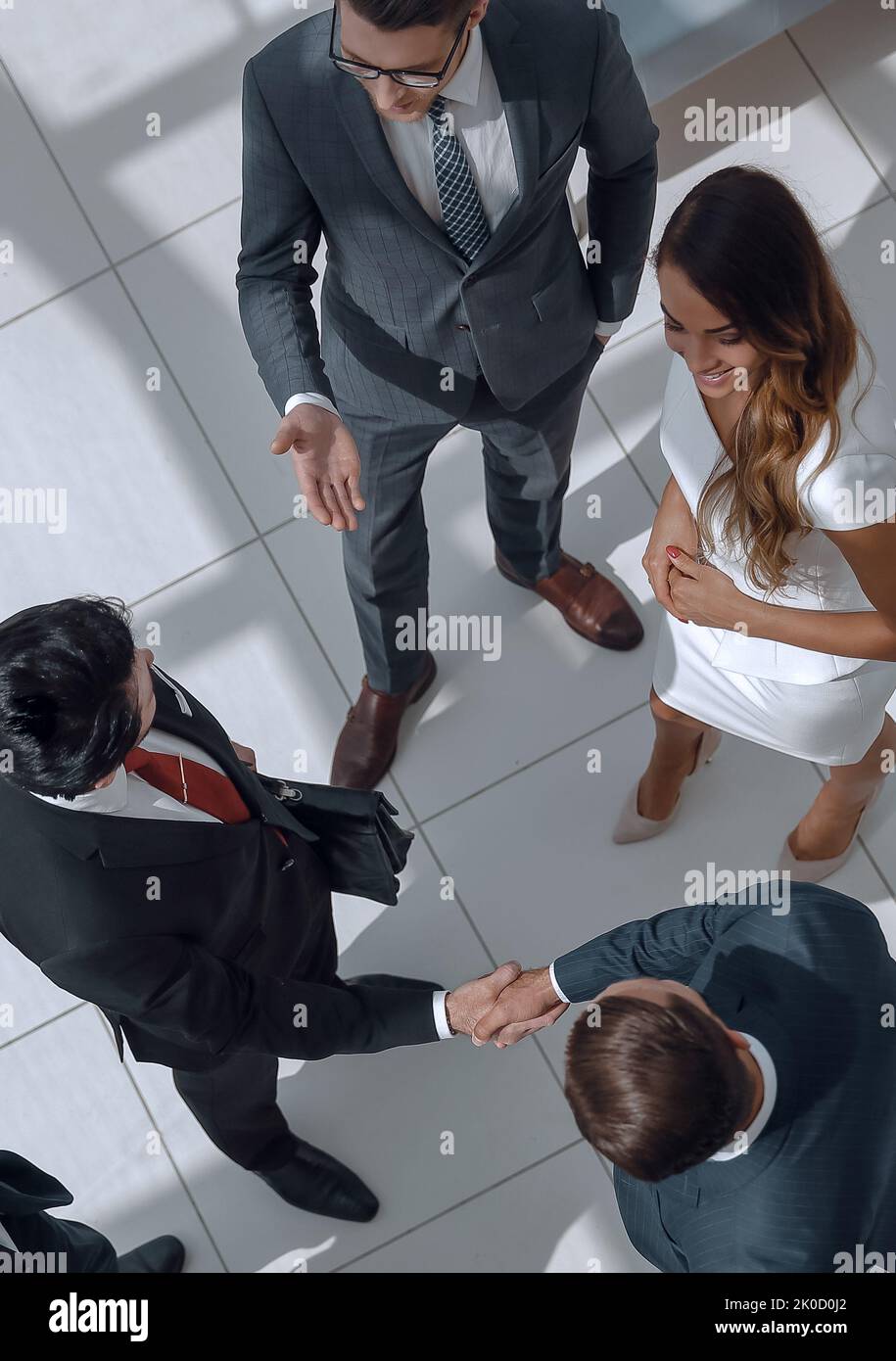 top view. handshake business partners at the meeting Stock Photo - Alamy