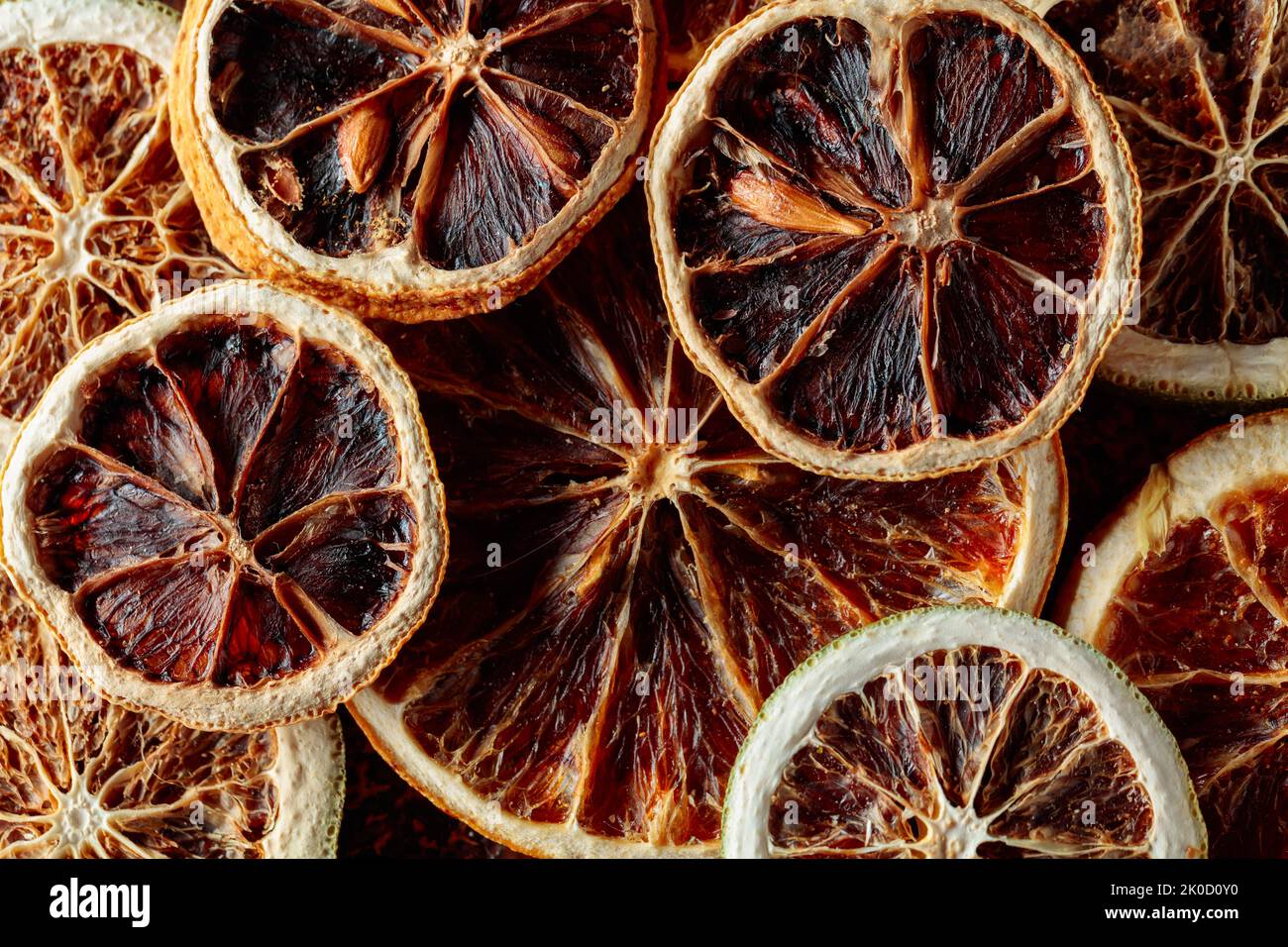 Dried orange slices background. Dehydrated crispy fruit slices. Pile of ...