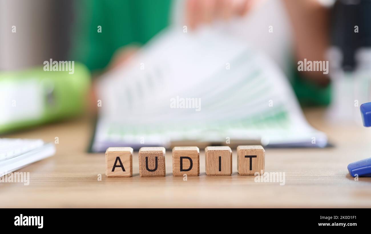 Woman accountant studies financial documents with reports and conducts ...