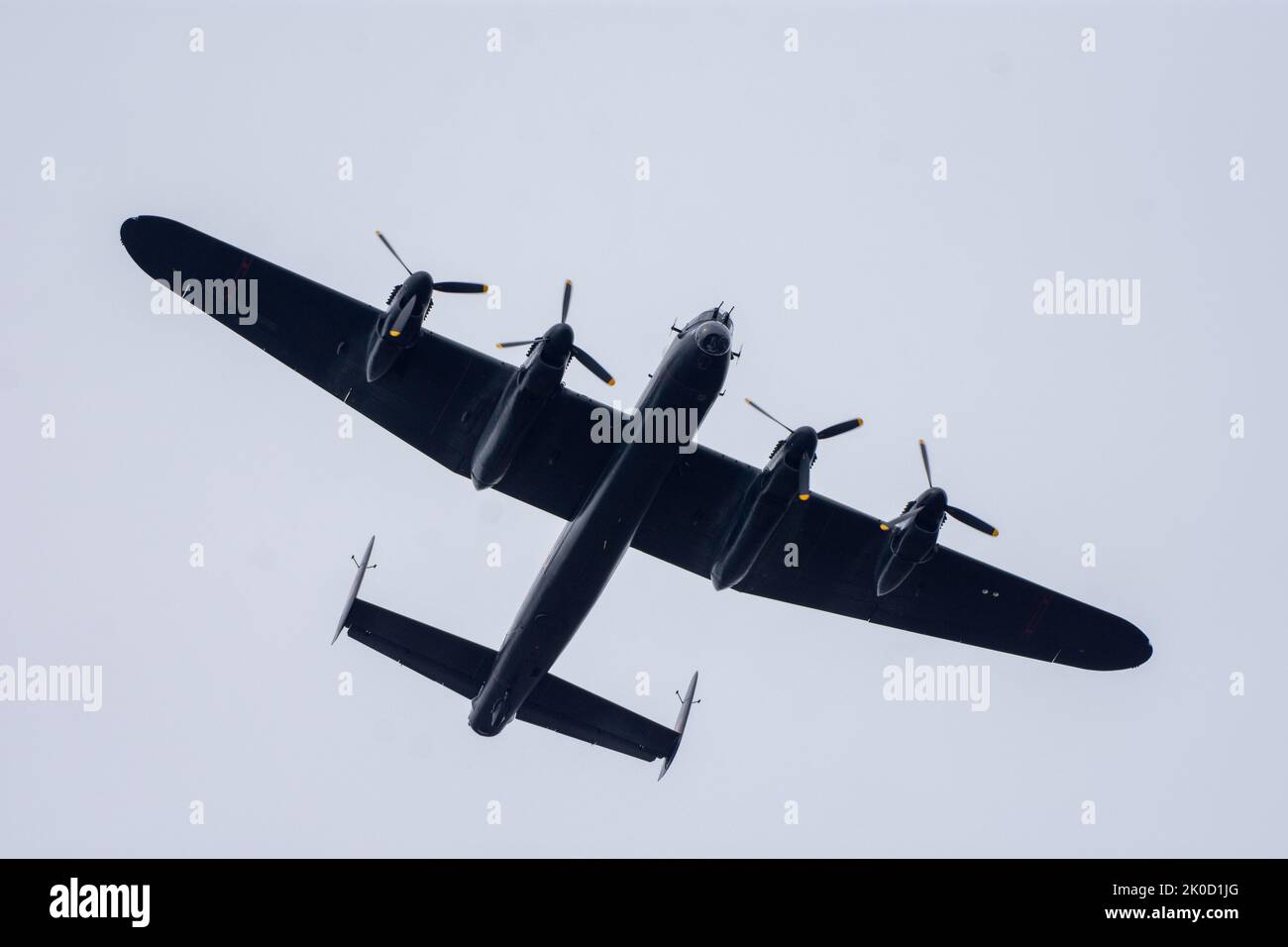 Lancaster bomber in flight seen from underneath showing the fuselage ...
